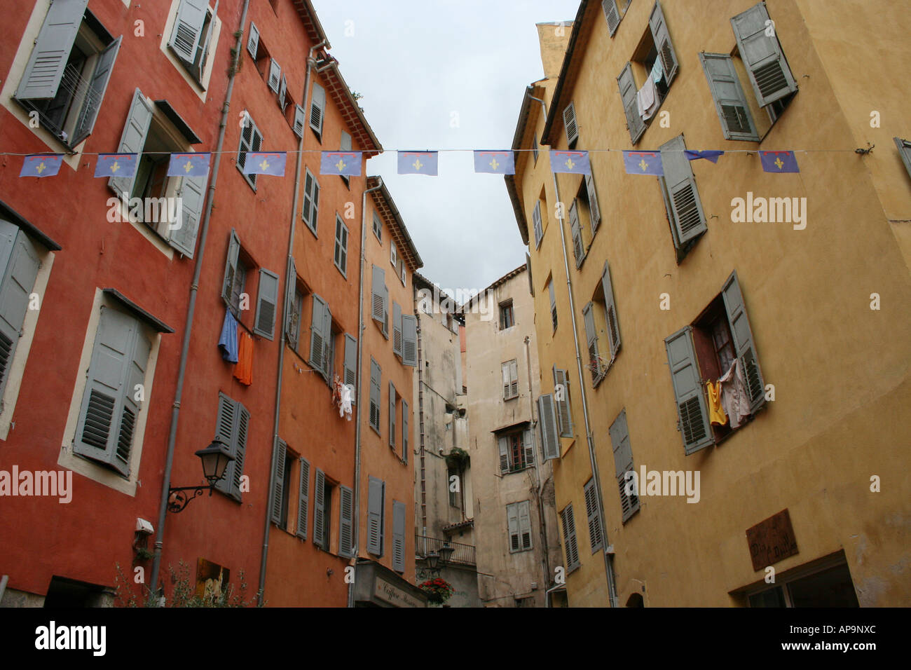 Colourful buildings Grasse in pastel shades with flags Grasse street ...