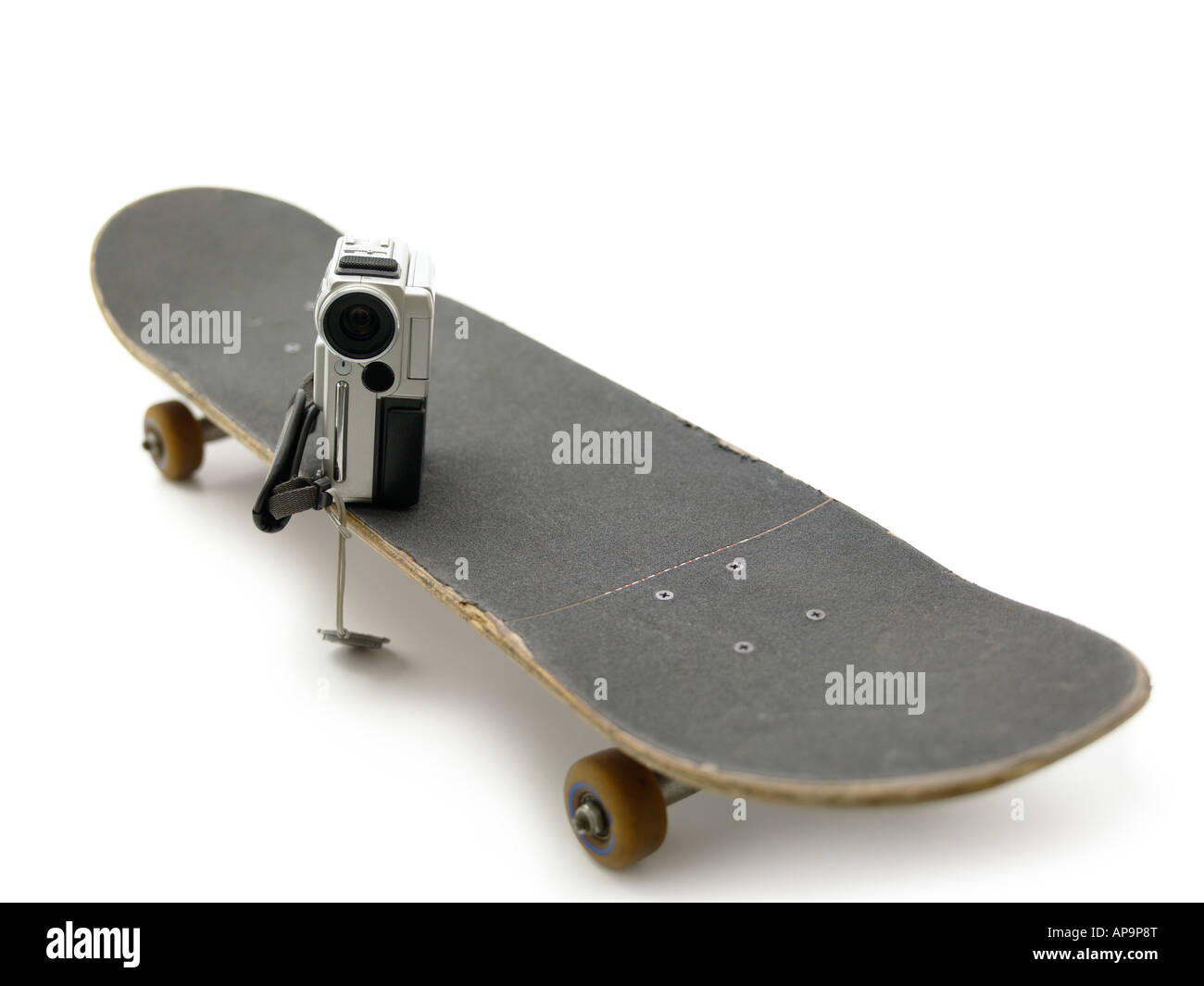 Skateboard and video camera Stock Photo - Alamy
