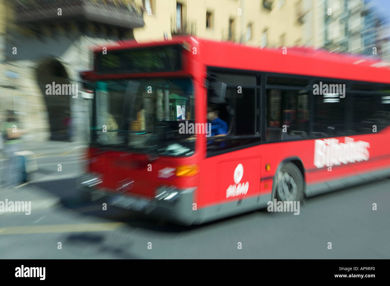 Red Bilbo bus moving through Casco Viejo Old Town Bilbao Stock Photo ...