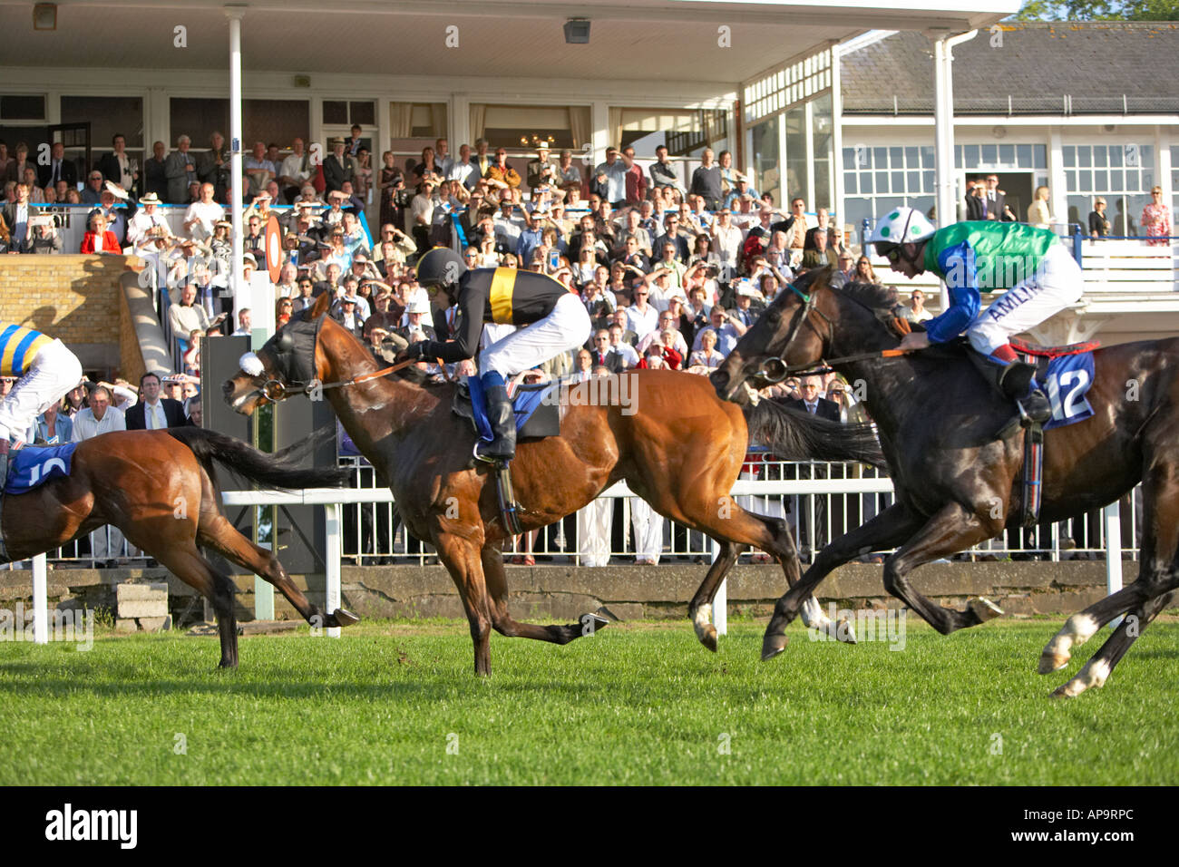 racehorses crossing the winning line at Windsor Royal Racecourse Stock ...