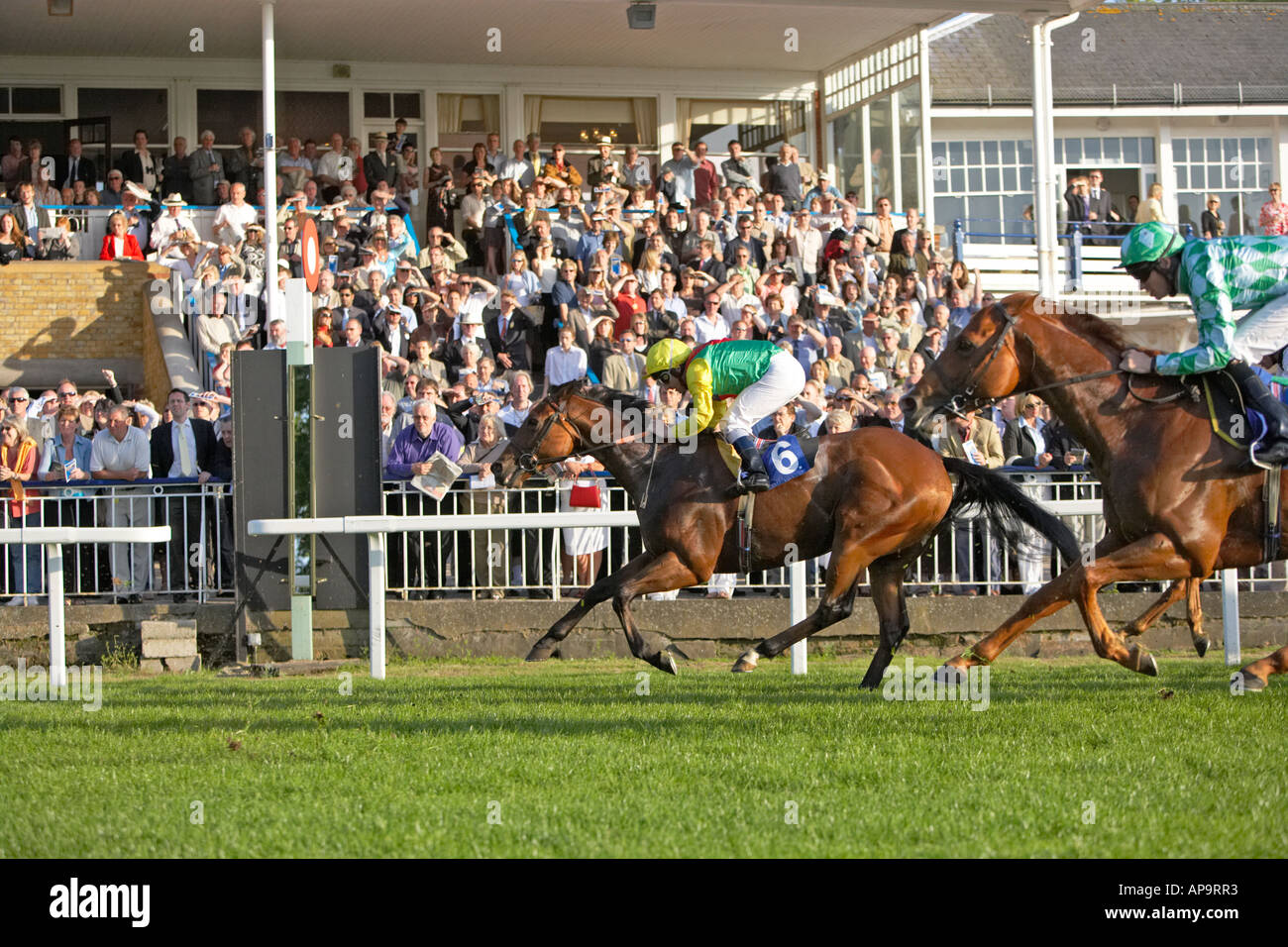 racehorses crossing the winning line at Windsor Royal Racecourse Stock ...