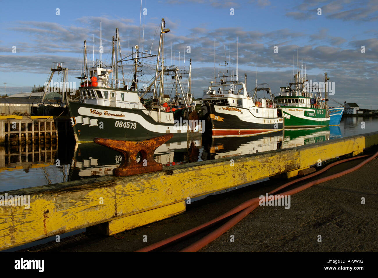 Row of fishing boats on the quay in Twillingate Harbour, Newfoundland ...