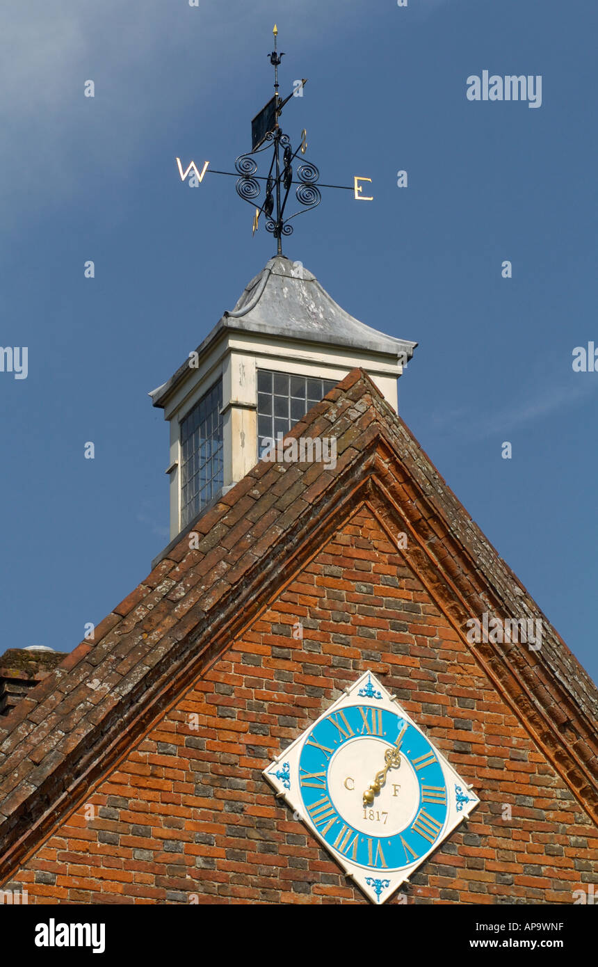 Bell Tower with Clock and Weather Vane on rooftop, England, UK Stock ...