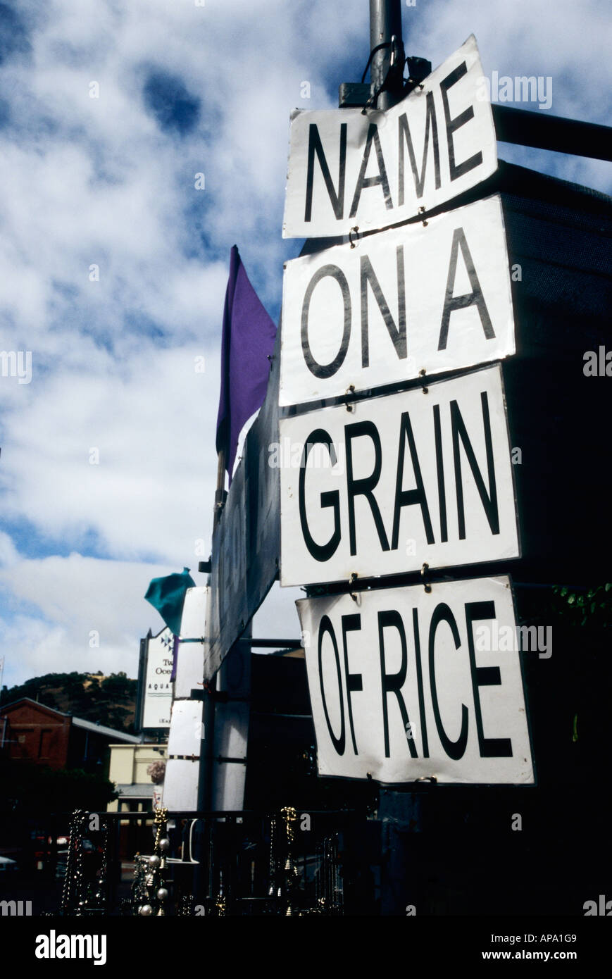 Name on a grain of rice sign at curio stall tourist attraction Victoria ...