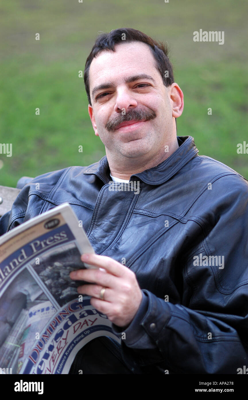 Man reading the paper Stock Photo - Alamy
