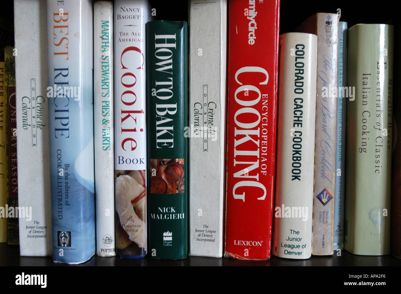 Cookbooks on black shelf big red book horizontal Stock Photo - Alamy