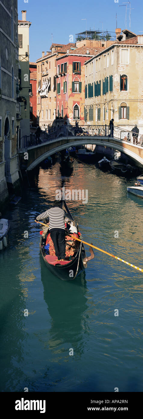People riding a gondola in venice Stock Photo - Alamy