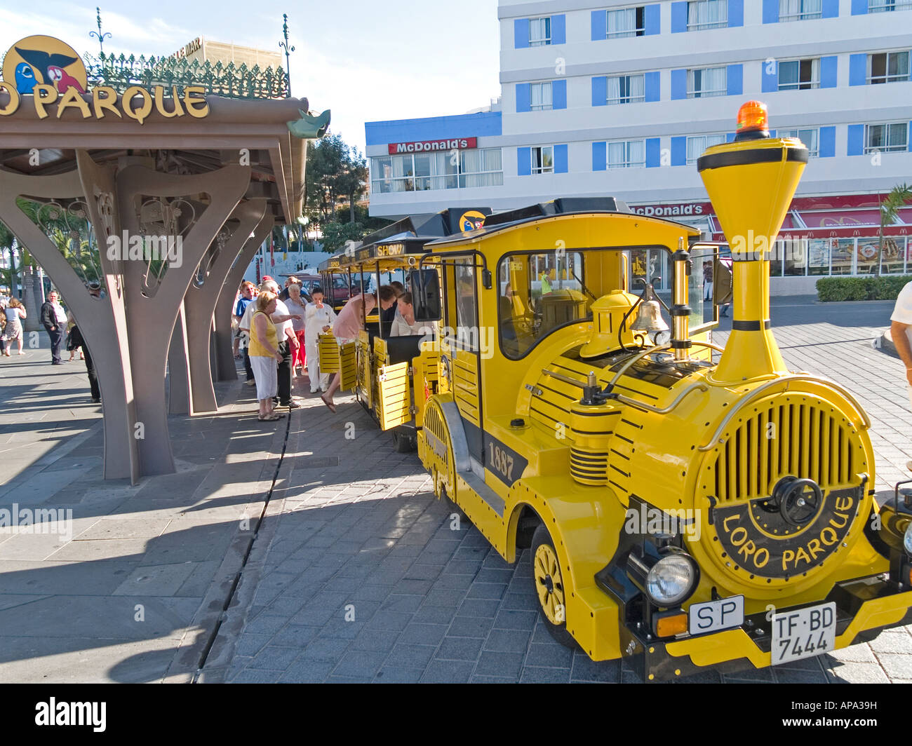 Yellow road train to take customers for the Loro Parque zoo to the ...