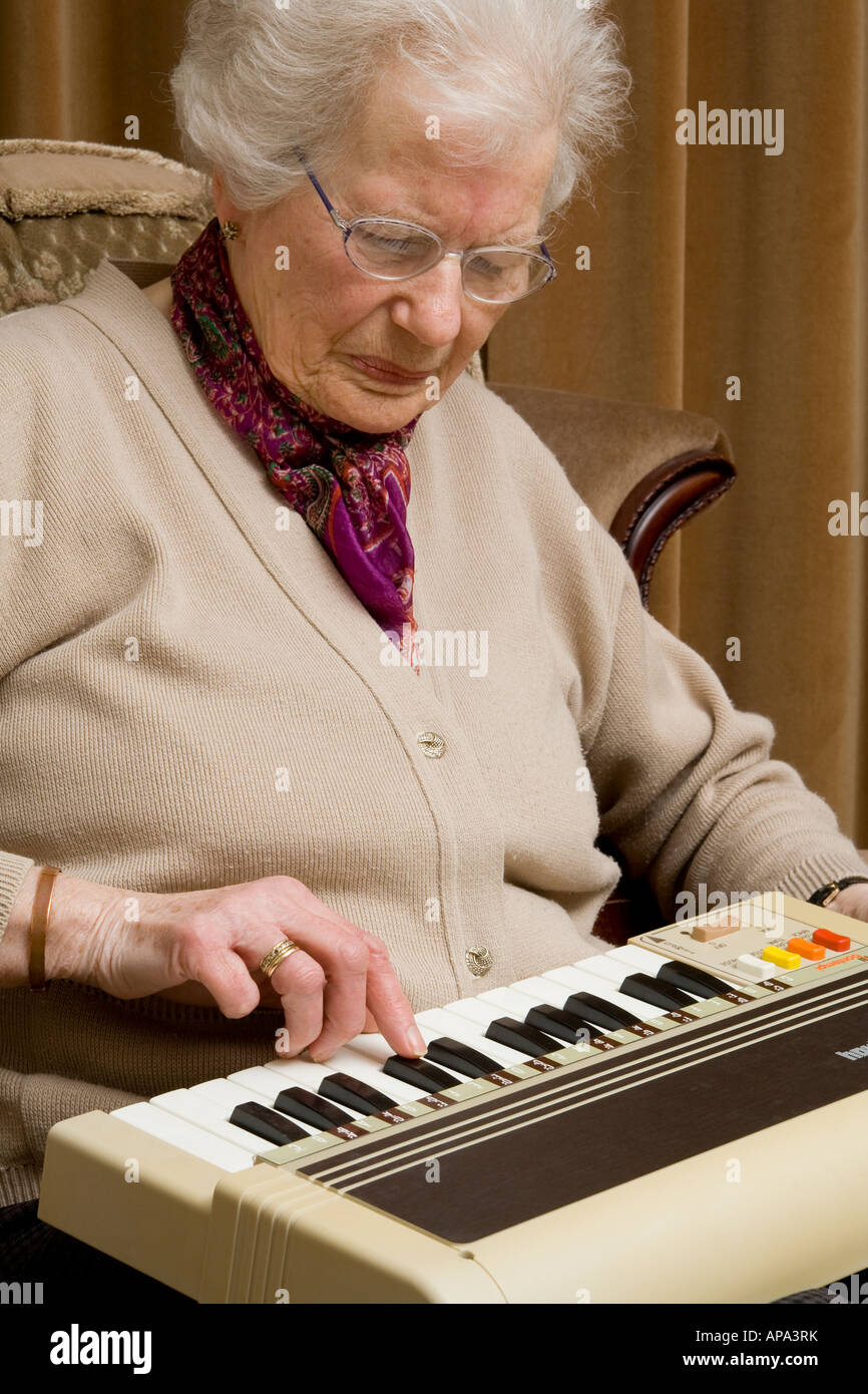 Senior playing a keyboard hi-res stock photography and images - Alamy