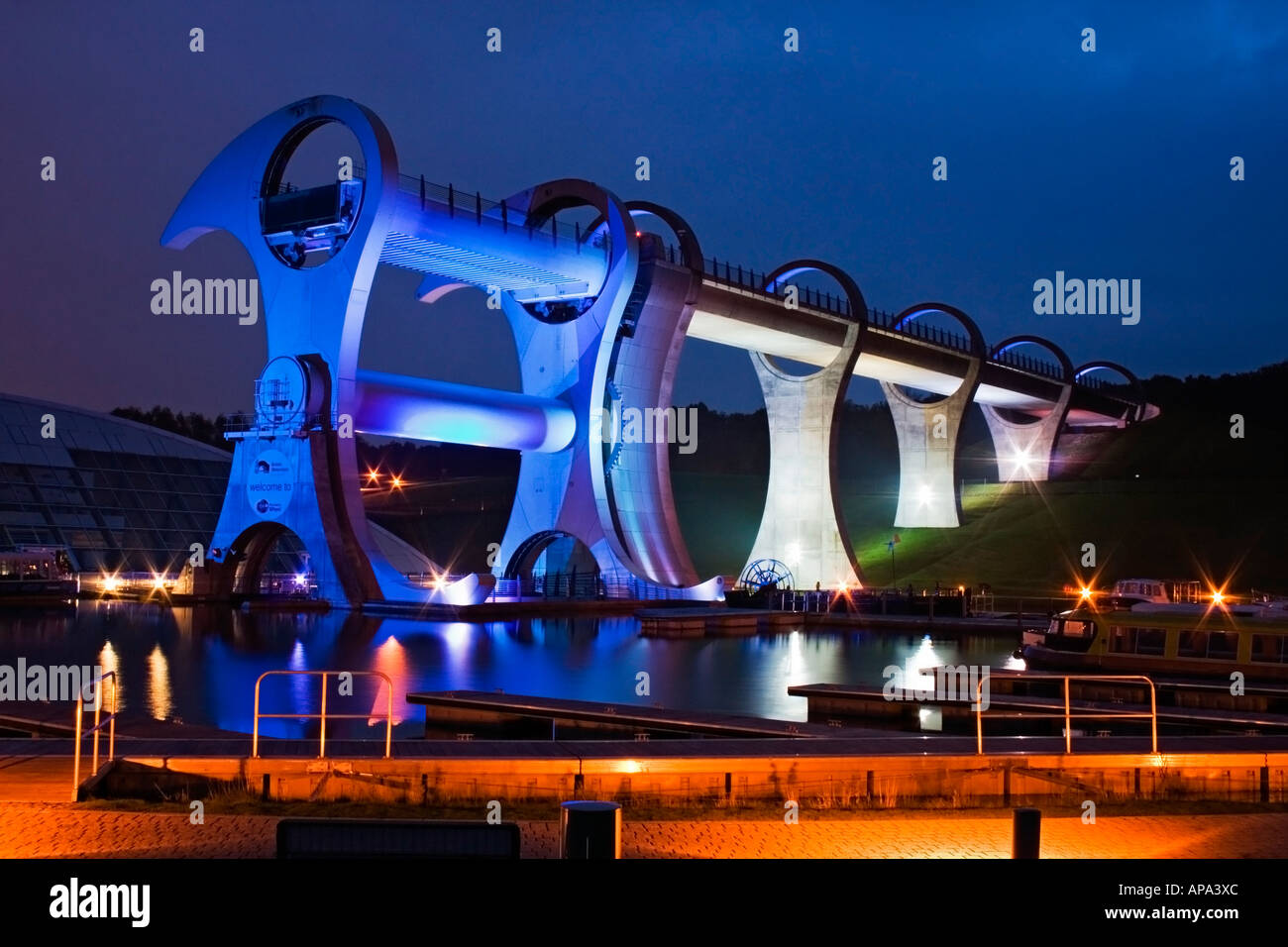 The Falkirk wheel at night illuminated by coloured floodlights, Falkirk ...