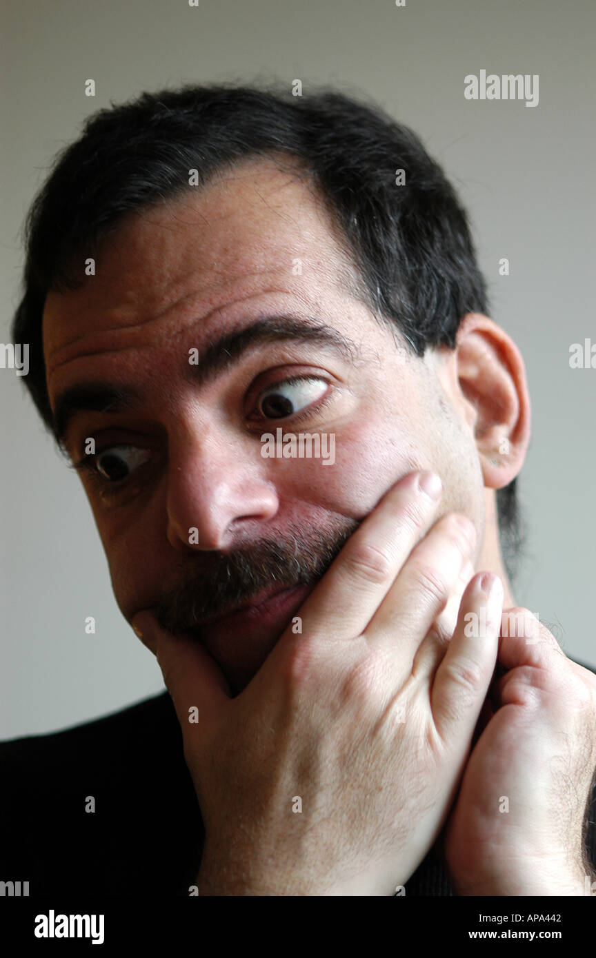 Portrait of a middle aged man showing sign of emotional distress Stock ...