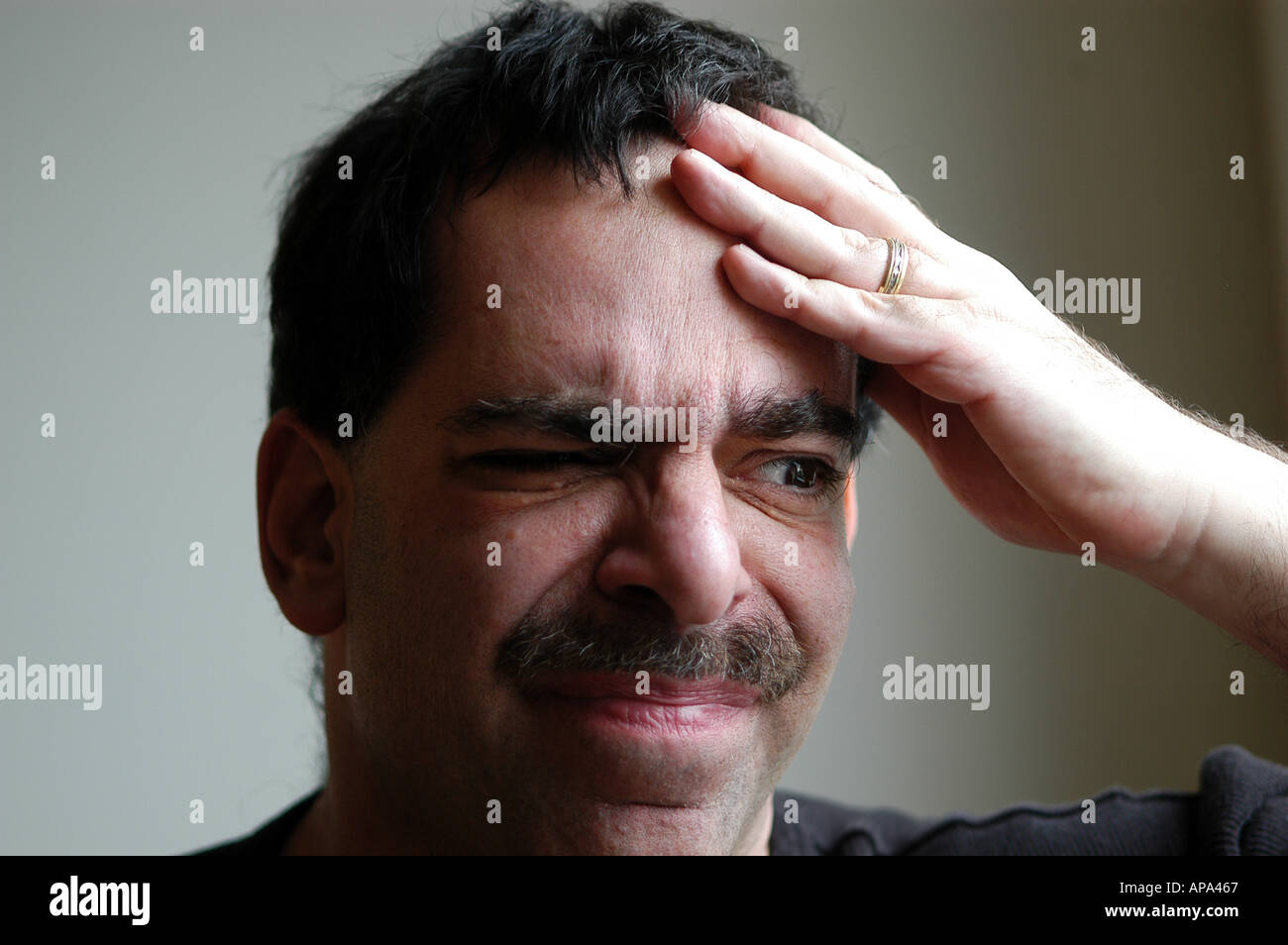 Portrait of a middle aged man showing sign of emotional distress Stock ...