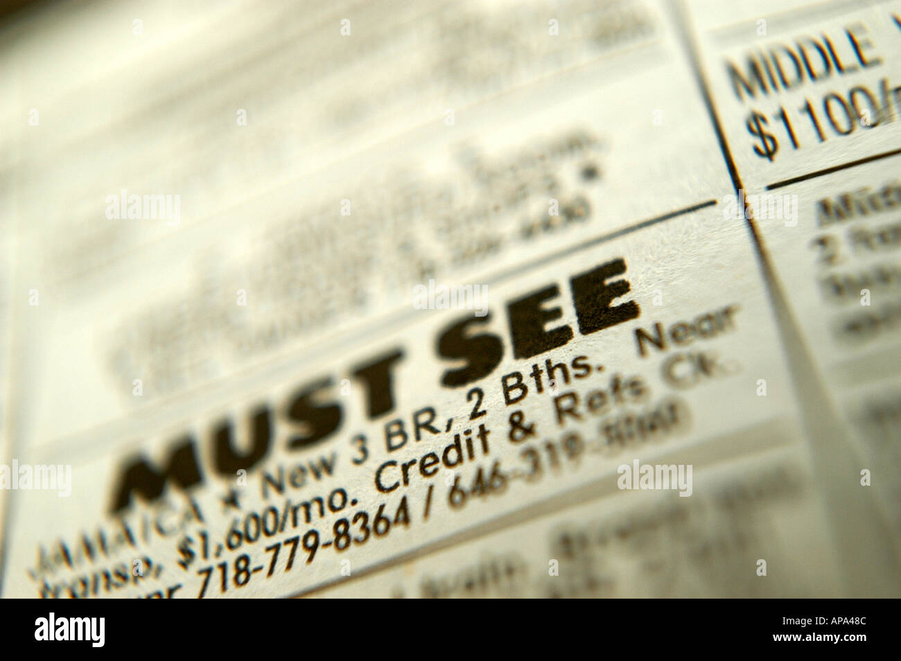 Newspaper classifieds MUST SEE ad Stock Photo - Alamy