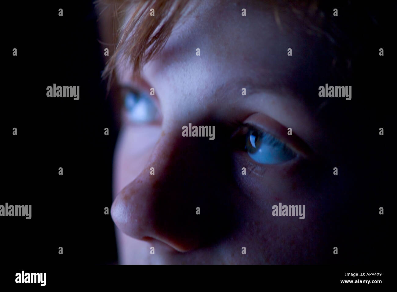 Closeup of young girl looking into computer screen Stock Photo - Alamy