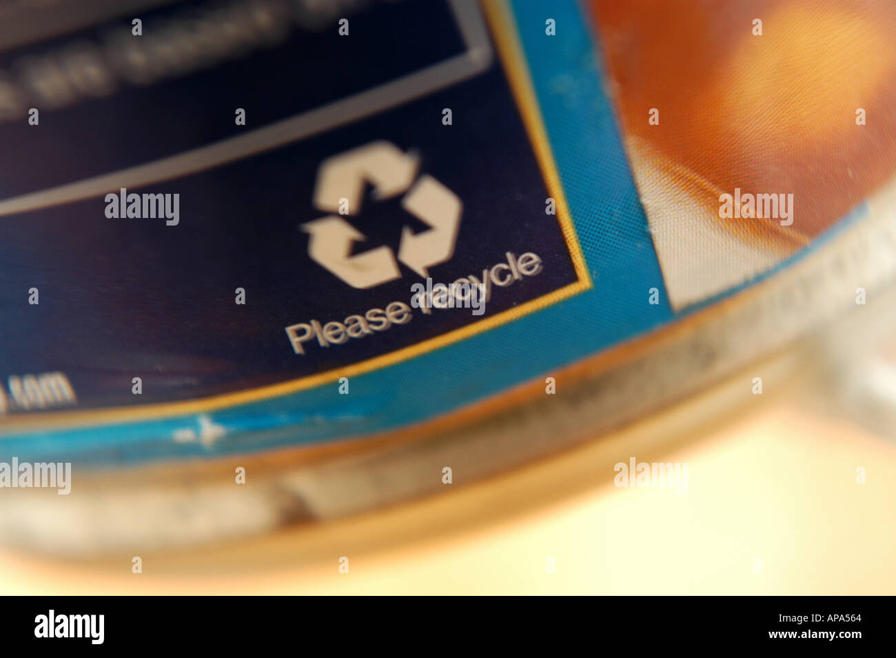 Close up blue label white recycle icon tilted left light blue outside ...