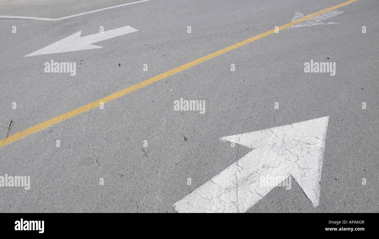 Road markings on USA road. Arrows pointing Stock Photo - Alamy