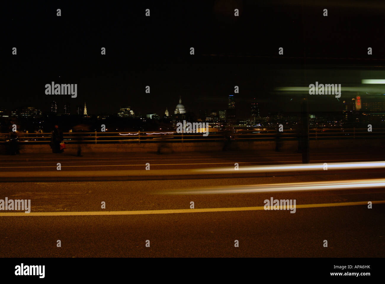 Waterloo Bridge shot at night with a slow shutter speed capturing the ...