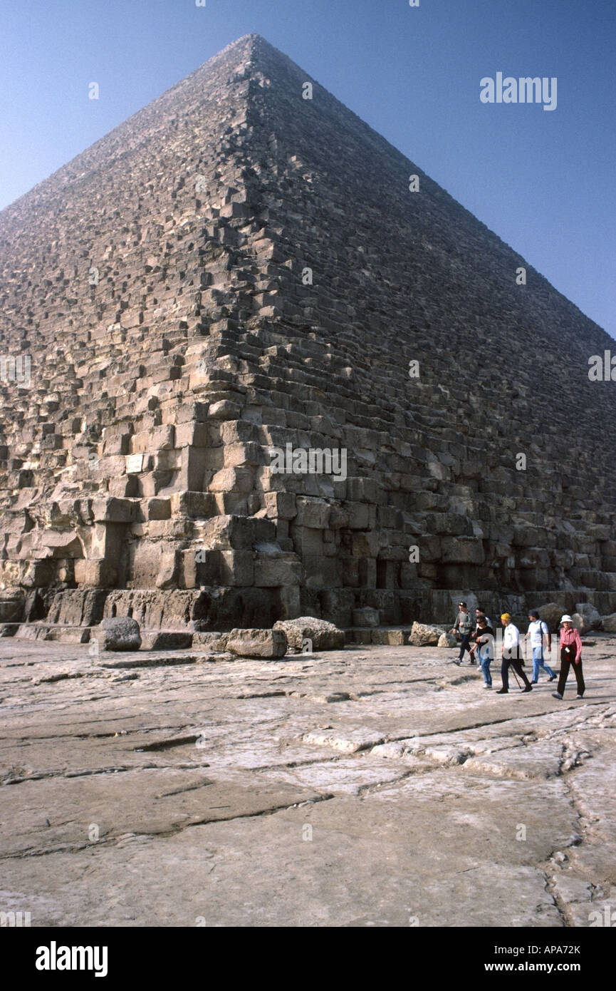 Tourists walking by the Great Pyramid of Giza Egypt Stock Photo - Alamy