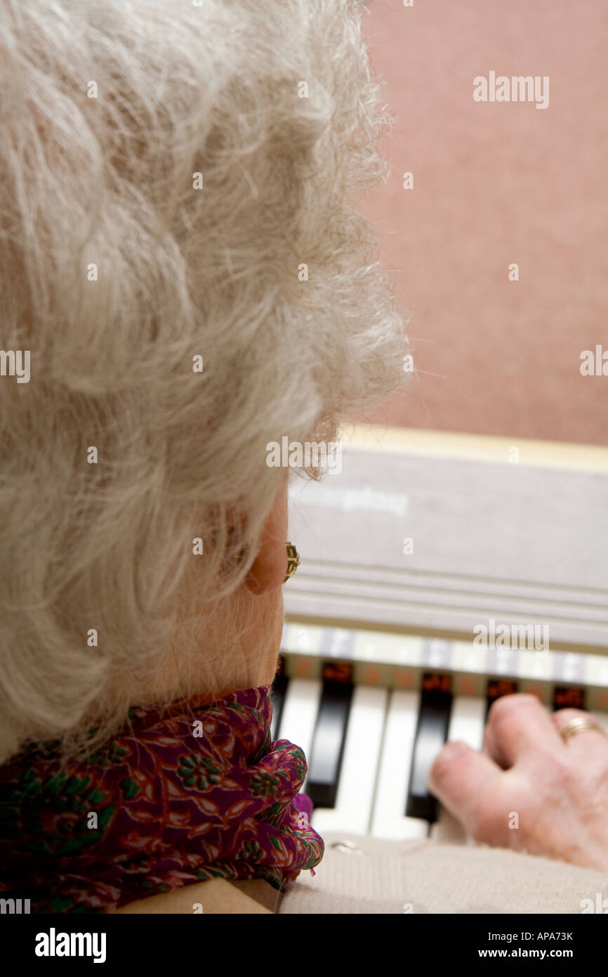 Old woman playing a keyboard hi-res stock photography and images - Alamy