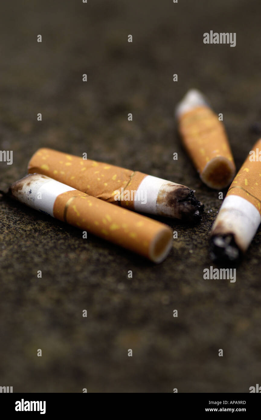 Discarded cigarette ends Stock Photo - Alamy