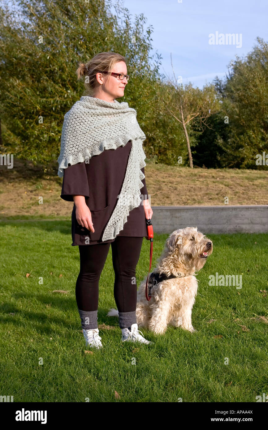 Woman and dog training Stock Photo - Alamy