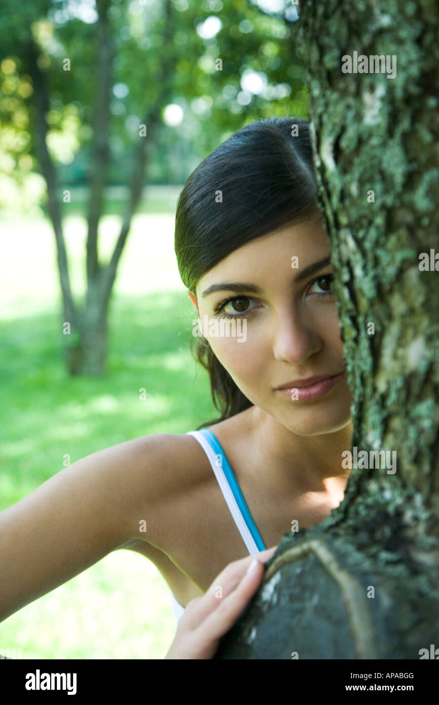 woman behind the tree Stock Photo - Alamy