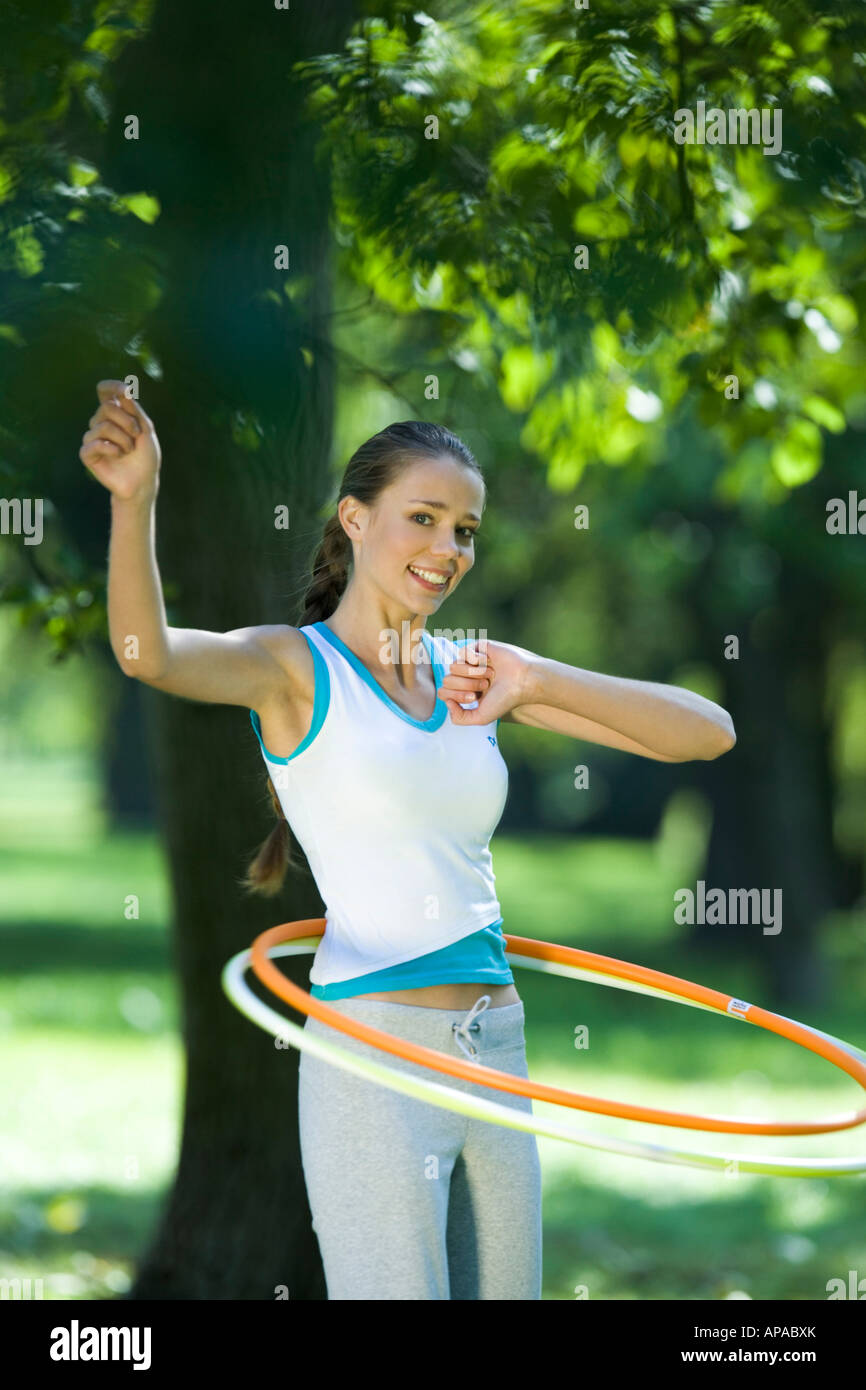 young woman with hoola hoop Stock Photo - Alamy