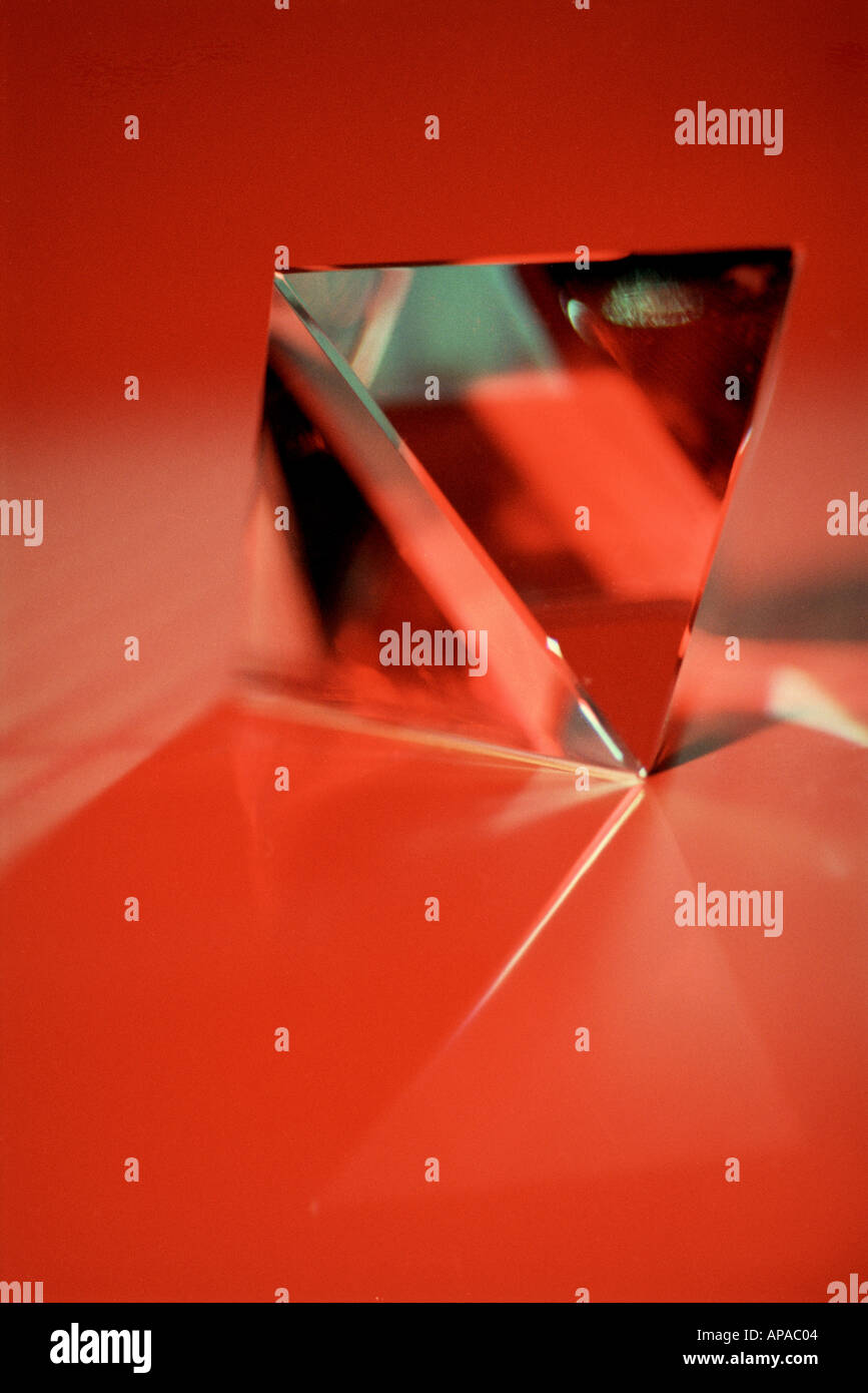 Light refraction through triangular crystal glass Stock Photo - Alamy