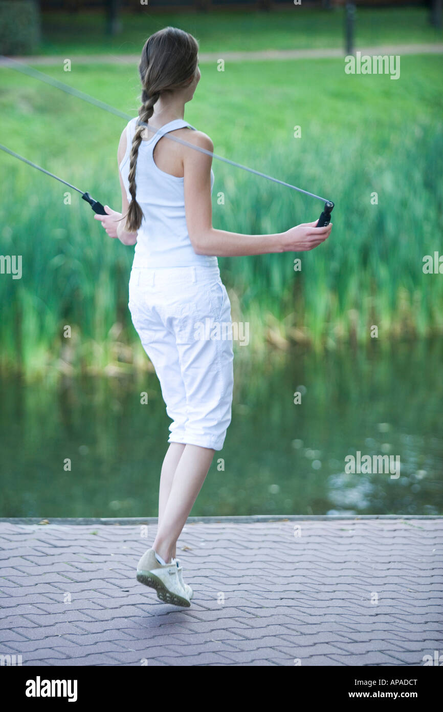 woman jumping on a jump rope Stock Photo - Alamy