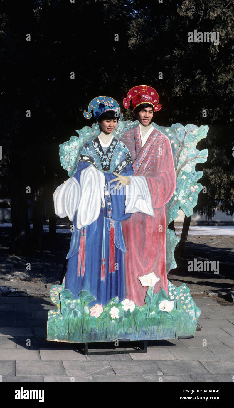 faces in photographer's cardboard cut-outs, Ming Tombs, Beijing, China ...