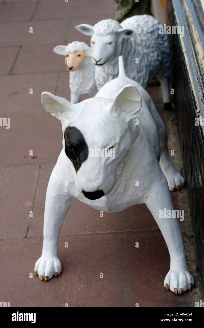 Dog and sheep models on pavement Stock Photo - Alamy