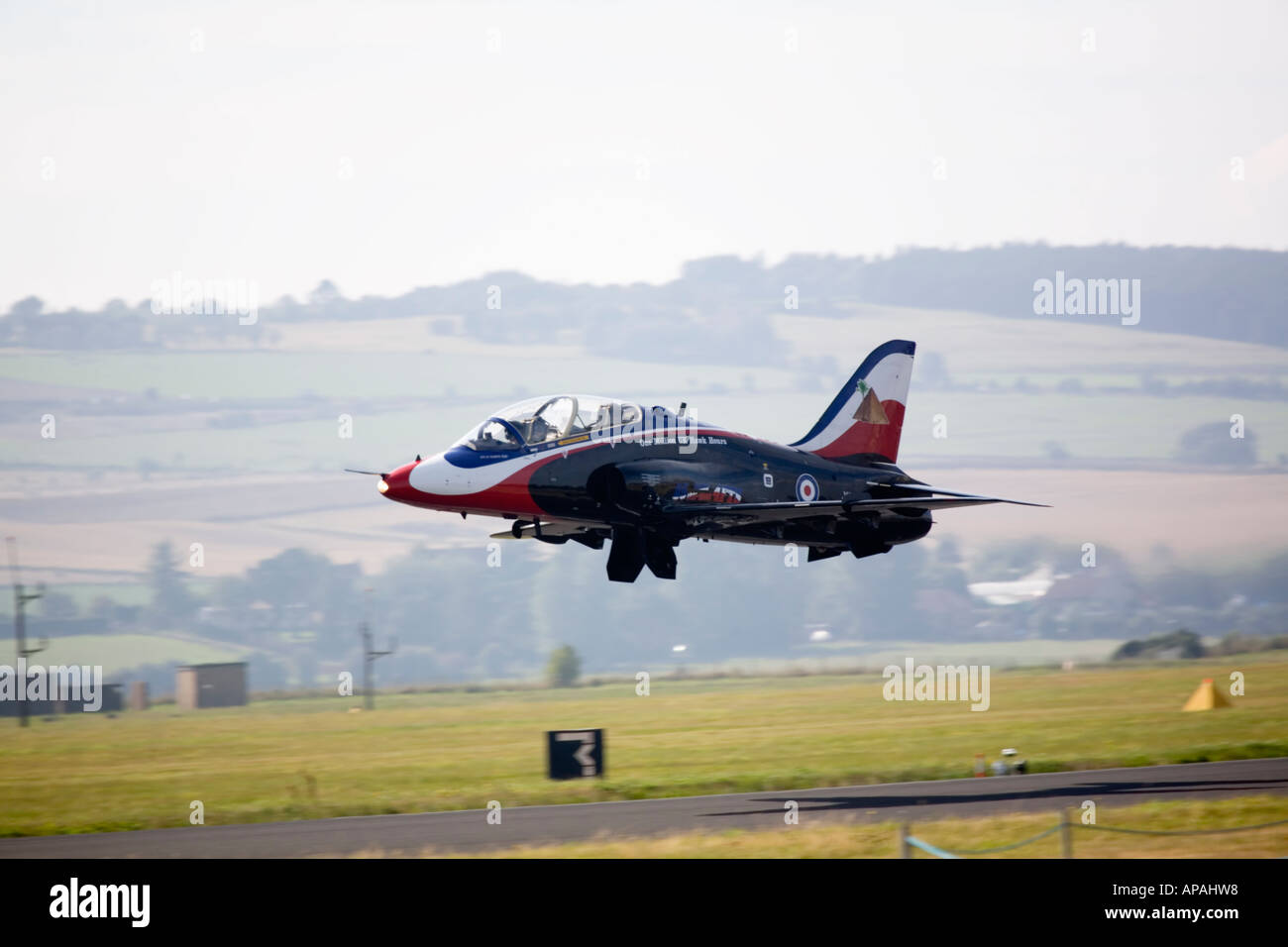 Hawk T1 RAF jet trainer low pass over airfield runway - colour scheme ...