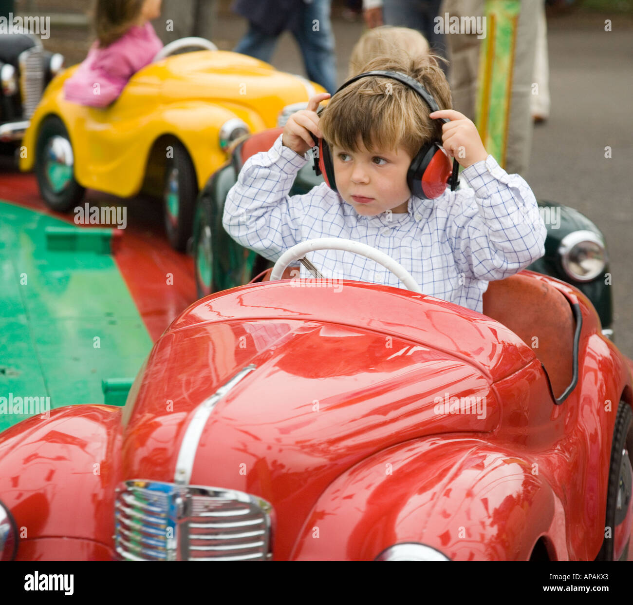 Children driving toy cars merry hi-res stock photography and images - Alamy