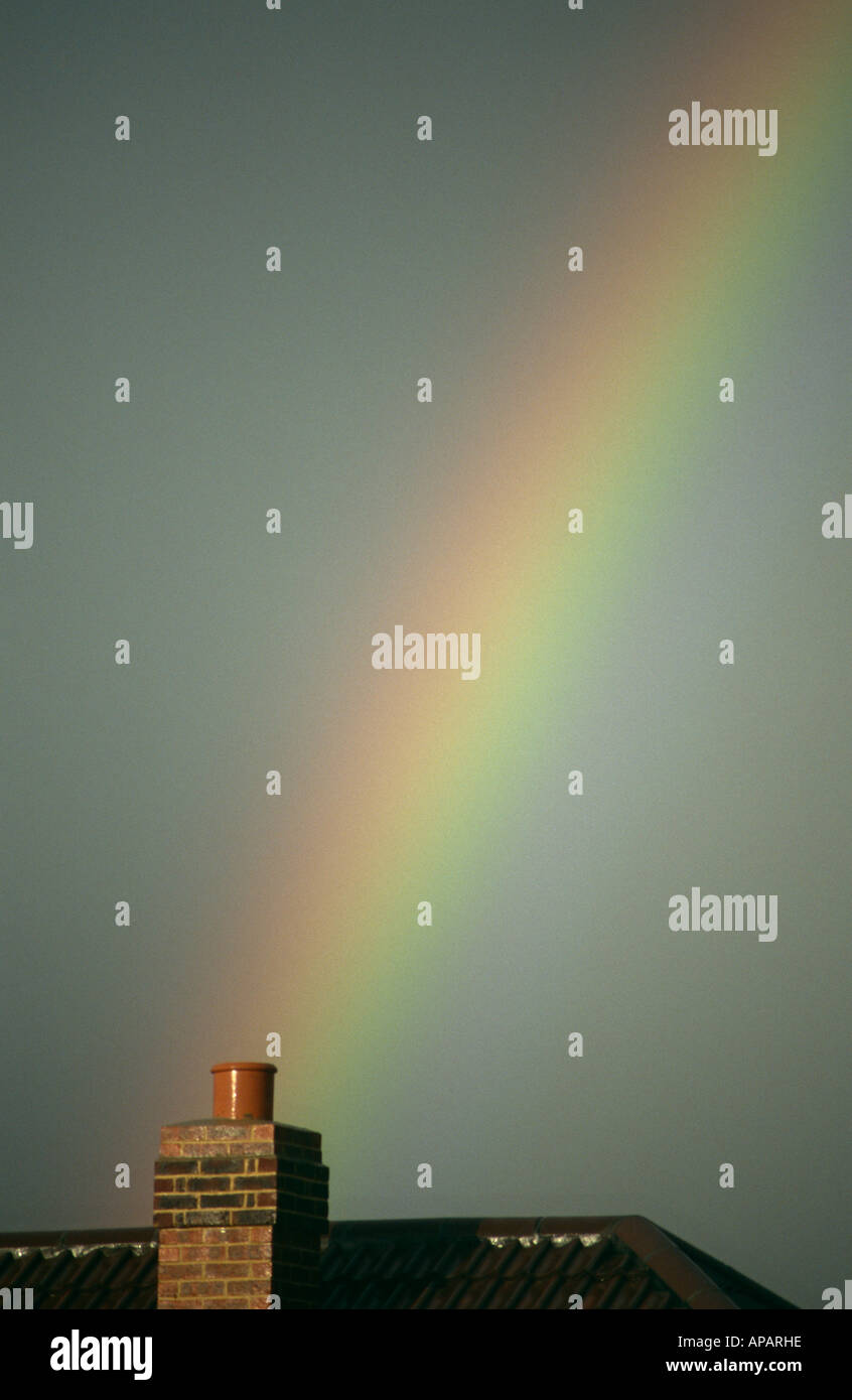 Rainbow over House Roof and Chimney, East Molesey, Surrey, England, UK ...