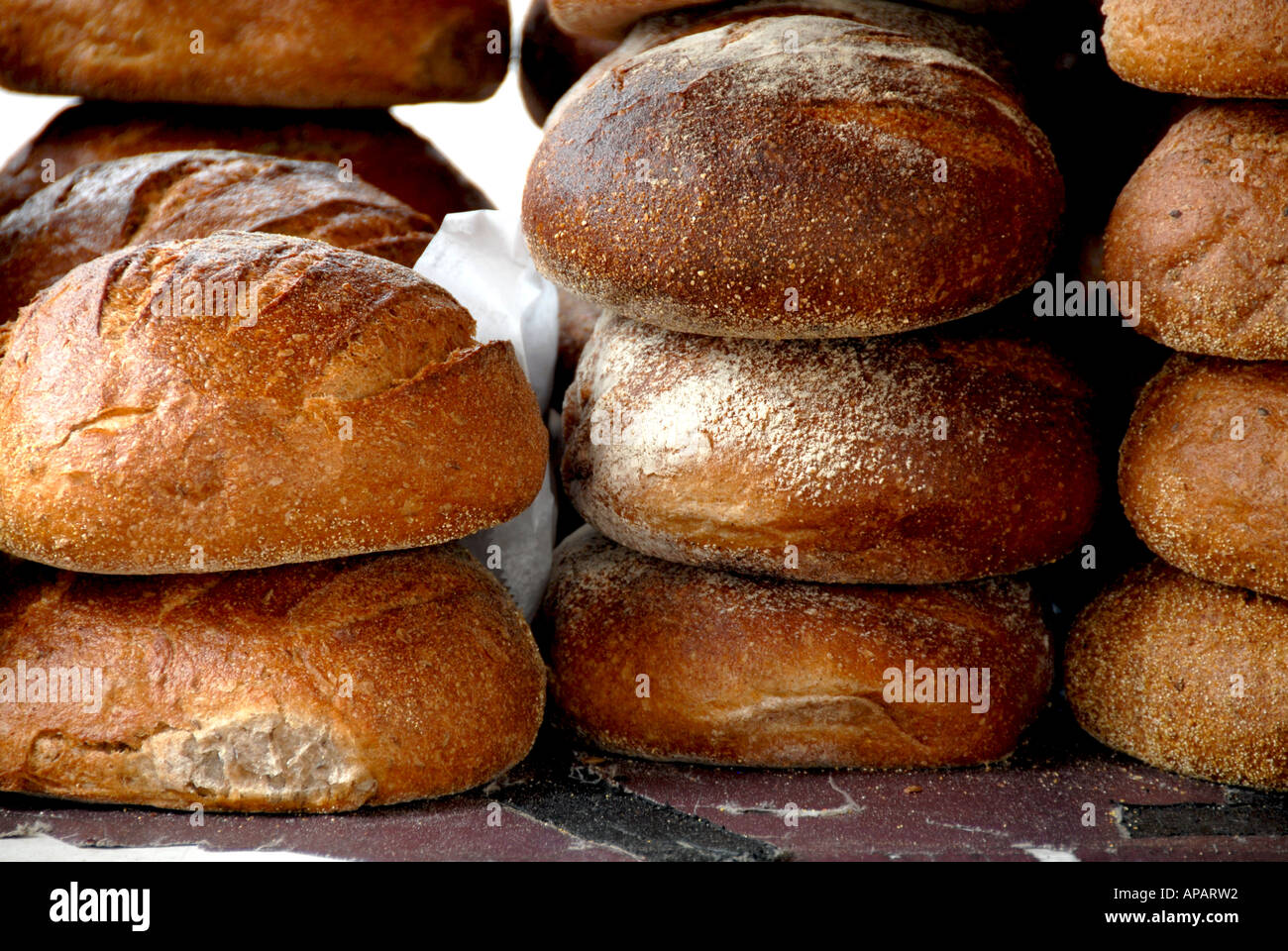 Round loaves of bread vertically stacked at a farmer s market Stock ...