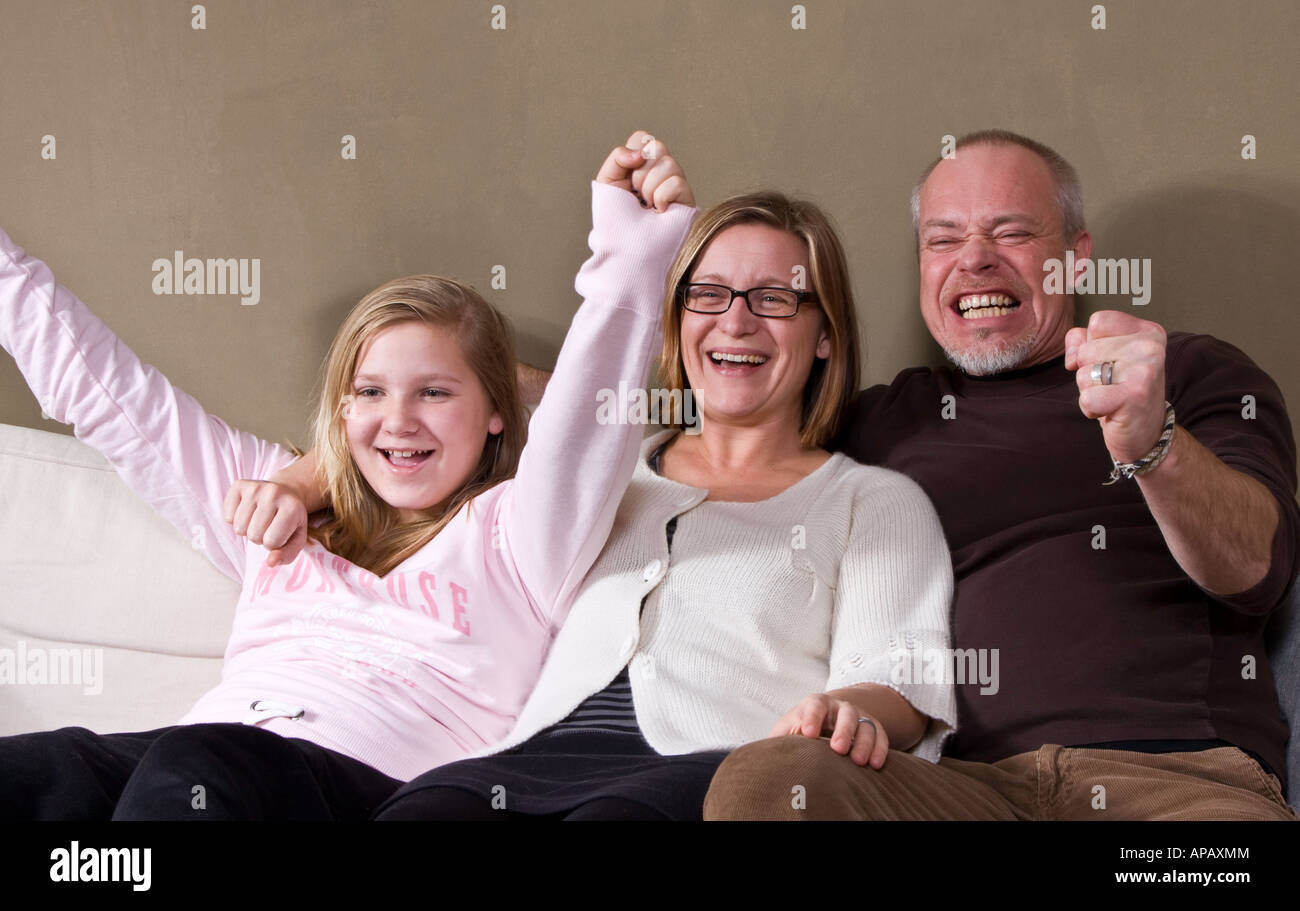 Family happy for winning Stock Photo - Alamy