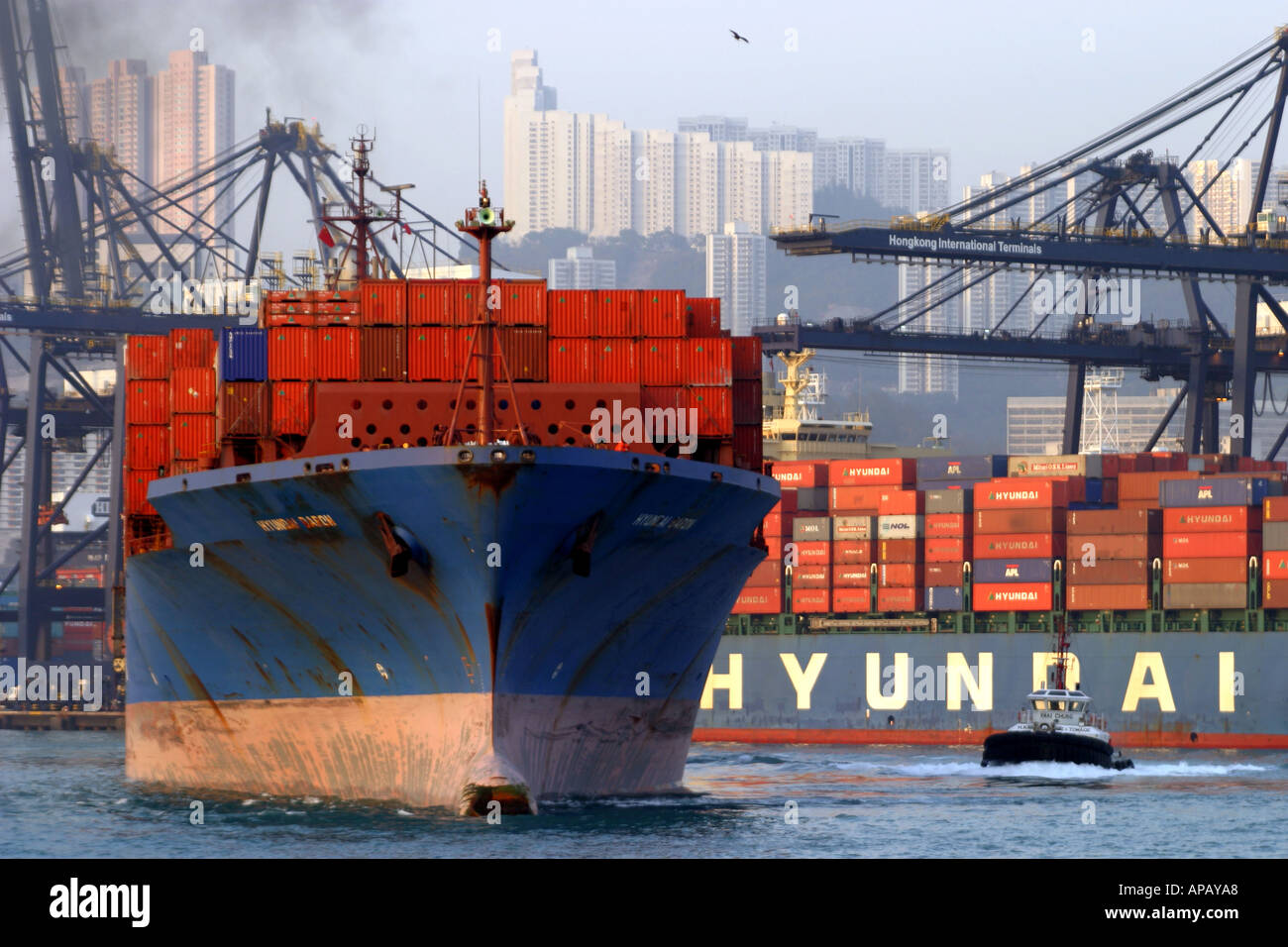 Hong Kong Container Shipping Ship Container Tug boat in front of big ...