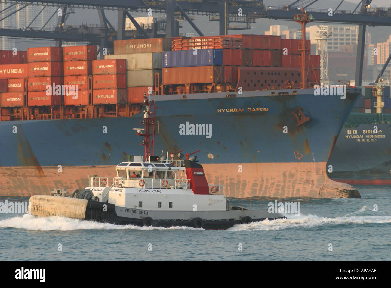 Hong Kong Container Shipping Ship Container Tug boat in front of big ...