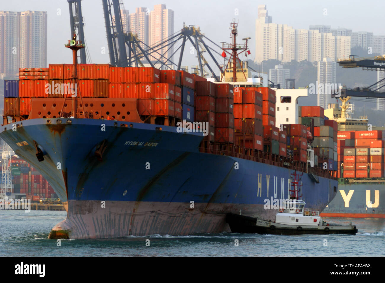 Hong Kong Shipping Ship Container Tug boat in front of big container ...