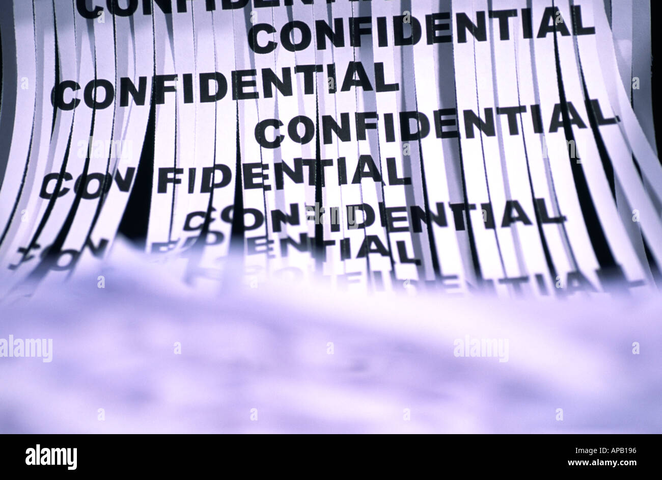 Confidential paper going through a shredder Stock Photo - Alamy