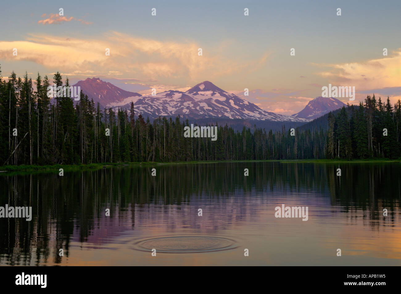 Scott Lake and the Three Sisters volcanic moutain peaks at sunset ...
