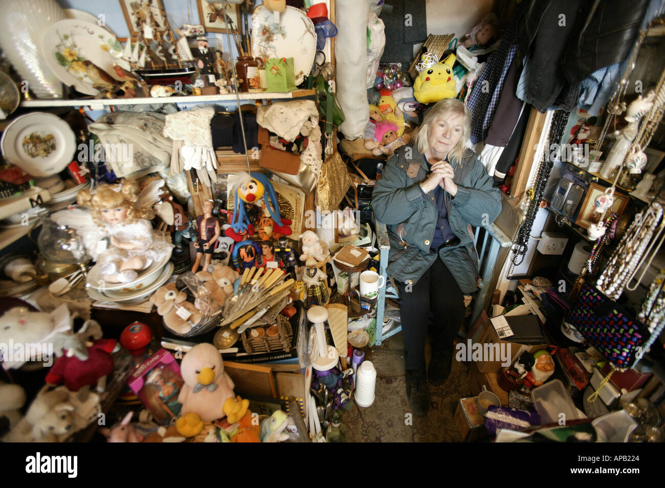Woman hoarding stuff Stock Photo - Alamy