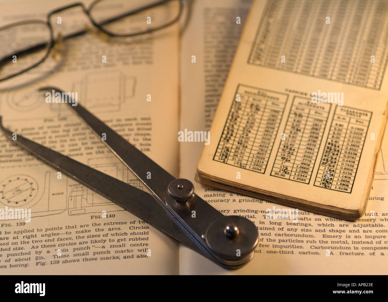 Engineers Measuring Callipers and Books Stock Photo - Alamy