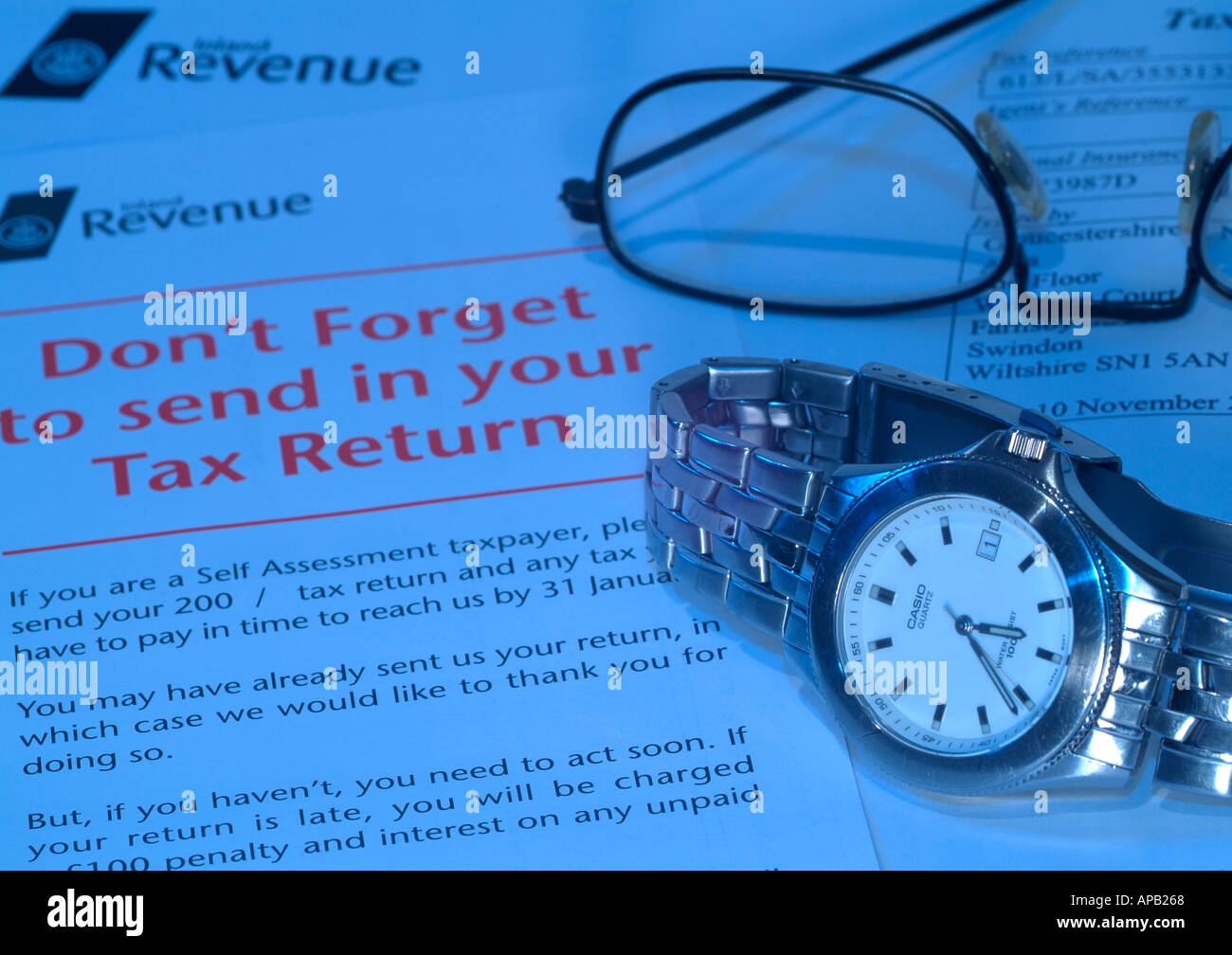 Tax Return Paperwork with Watch and Spectacles Stock Photo - Alamy