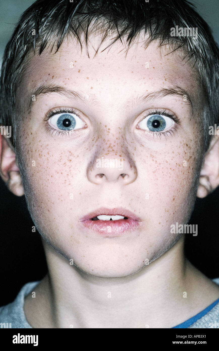 Portrait of a startled young boy Stock Photo - Alamy