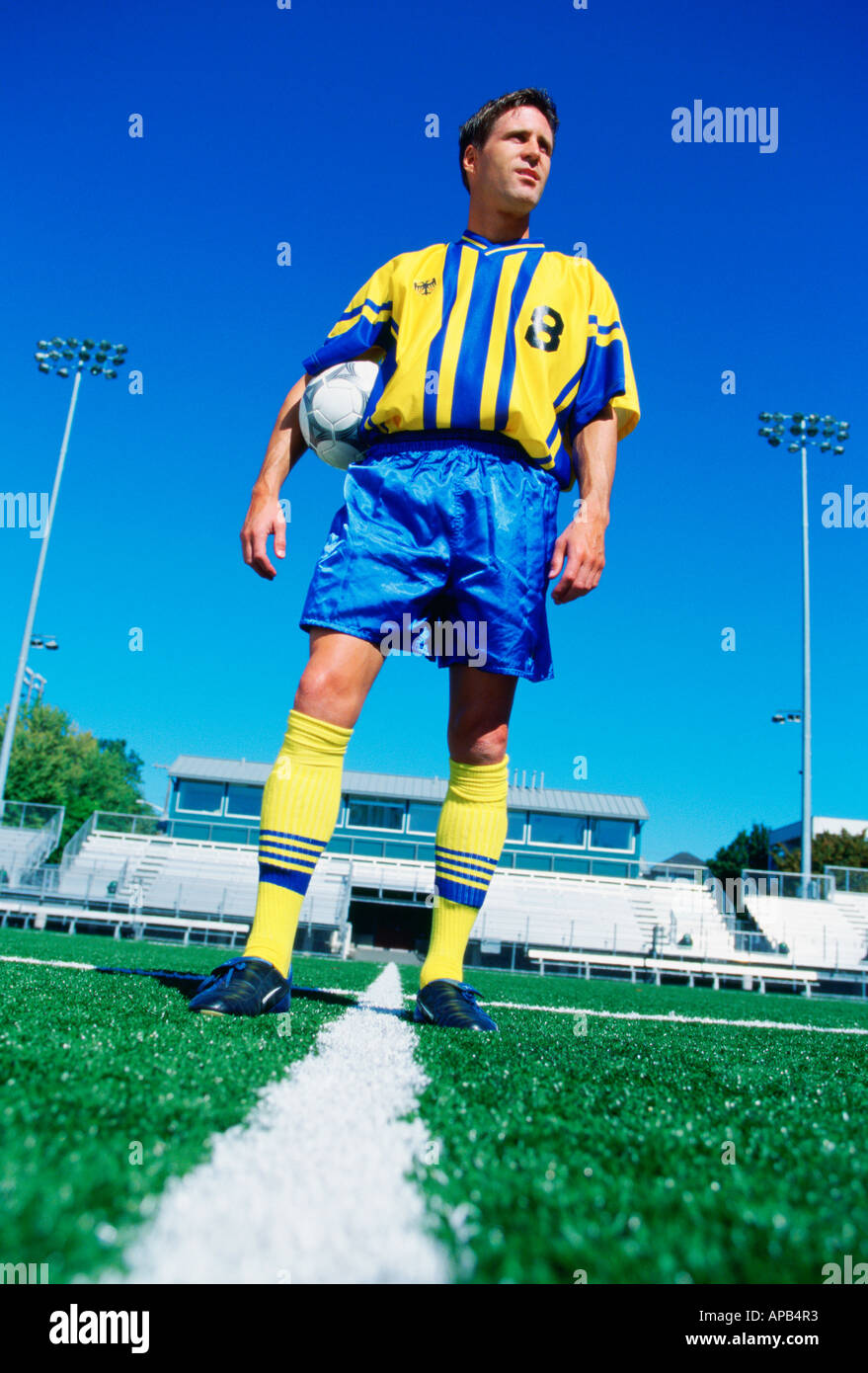 Professional soccer player with ball Stock Photo - Alamy
