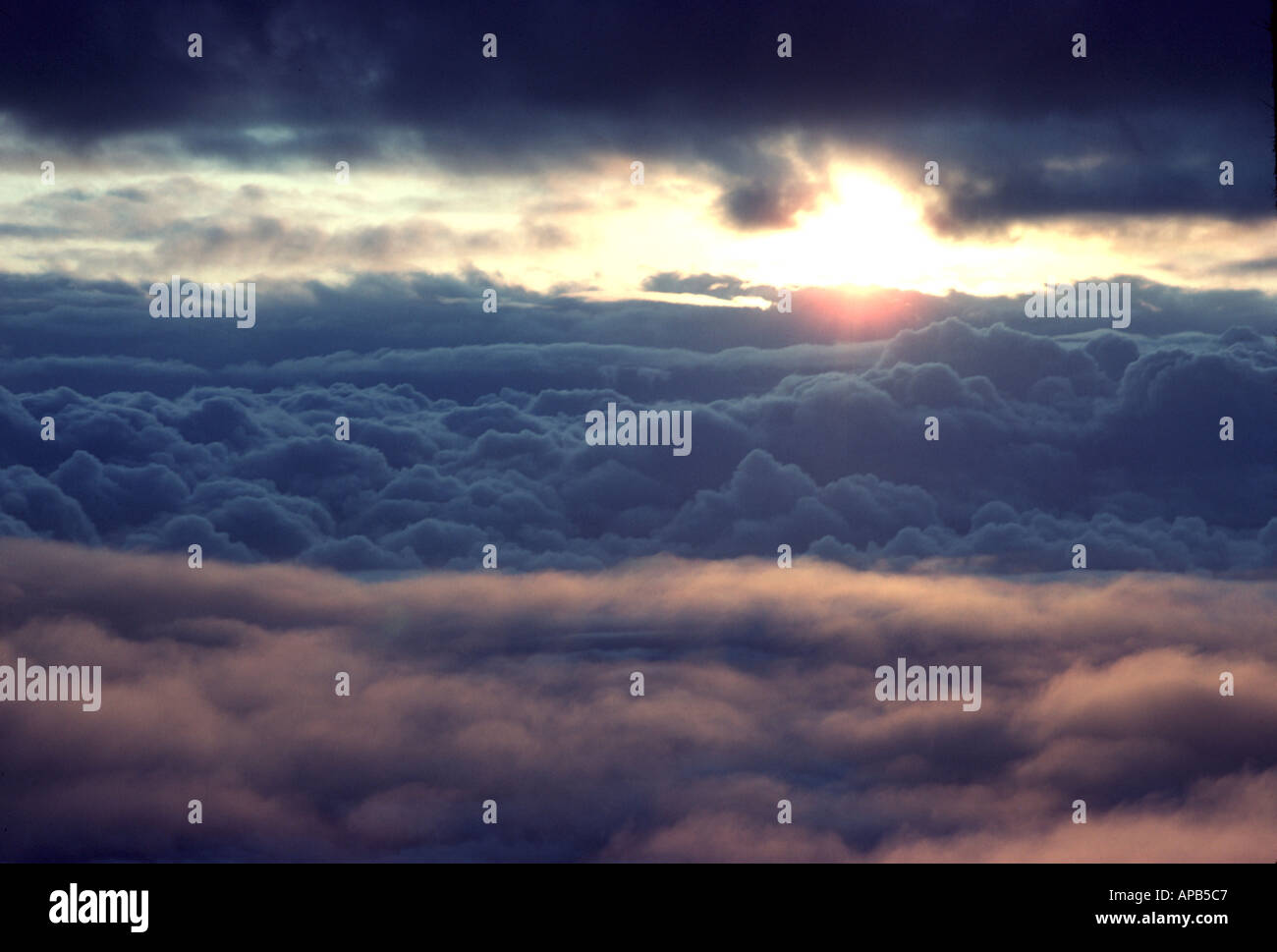 Sunset through clouds flying heavenly hi-res stock photography and ...