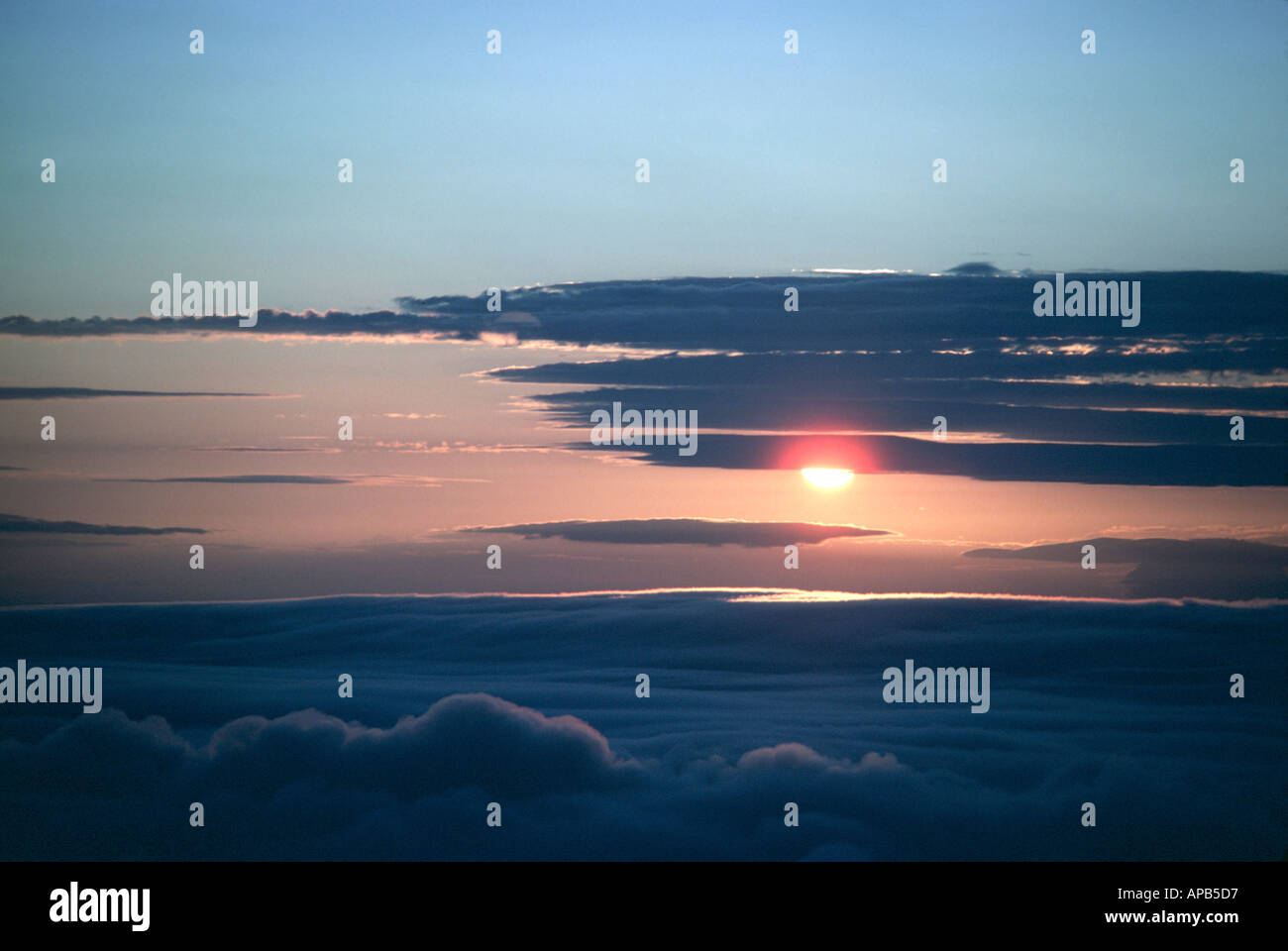 Sunset through clouds flying heavenly hi-res stock photography and ...