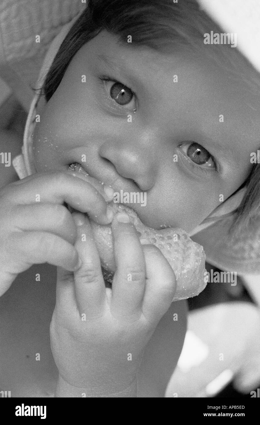 small girl eating cake Stock Photo - Alamy