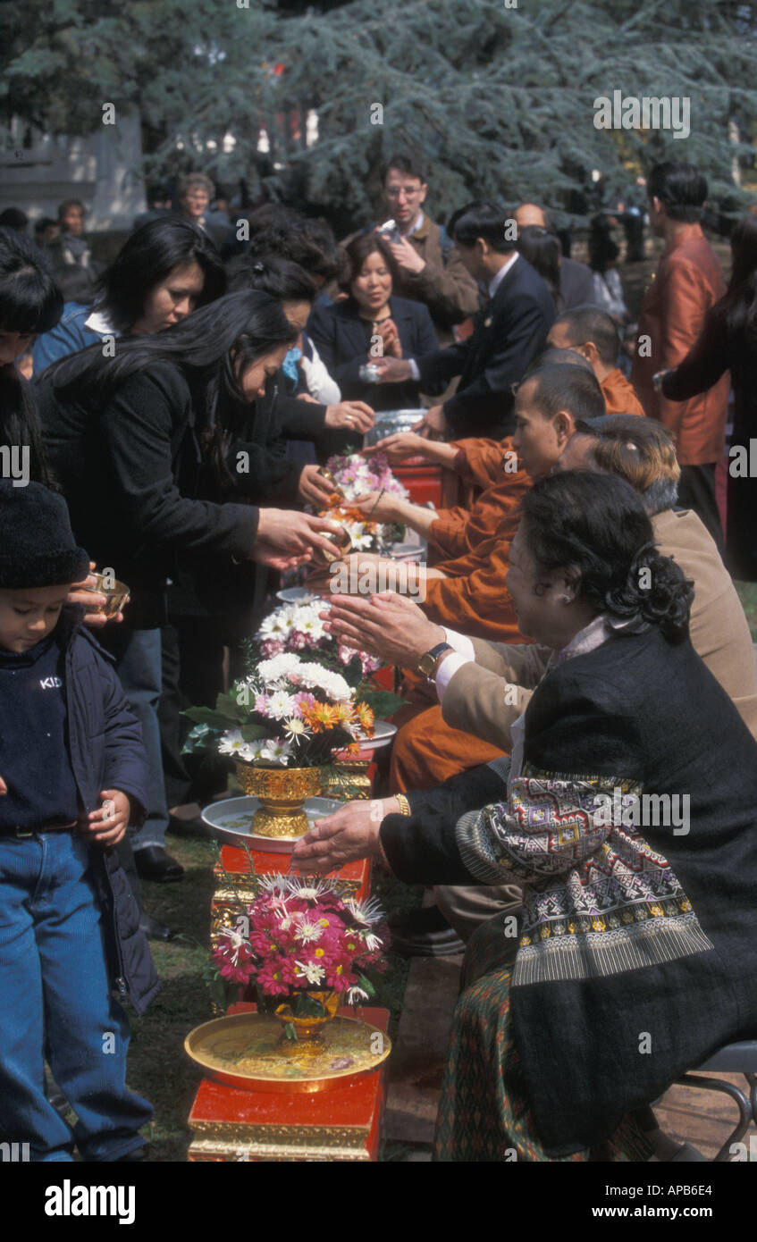 Monks and lay people celebrate the Buddhist new year Stock Photo - Alamy